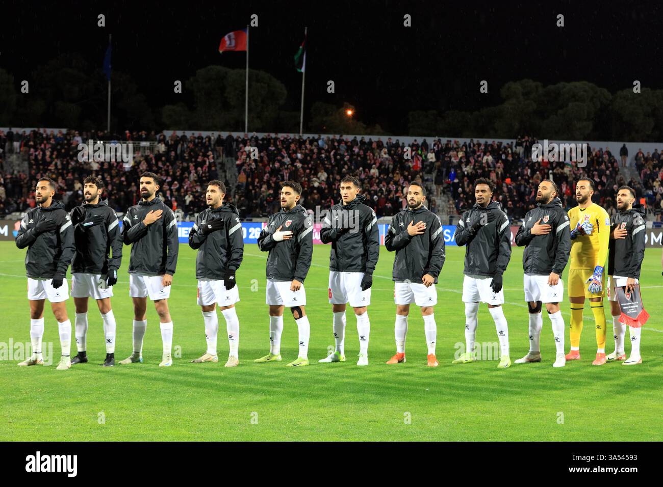 Amman, Jordan. 20th Mar, 2025. Players of Jordan line up before the ...