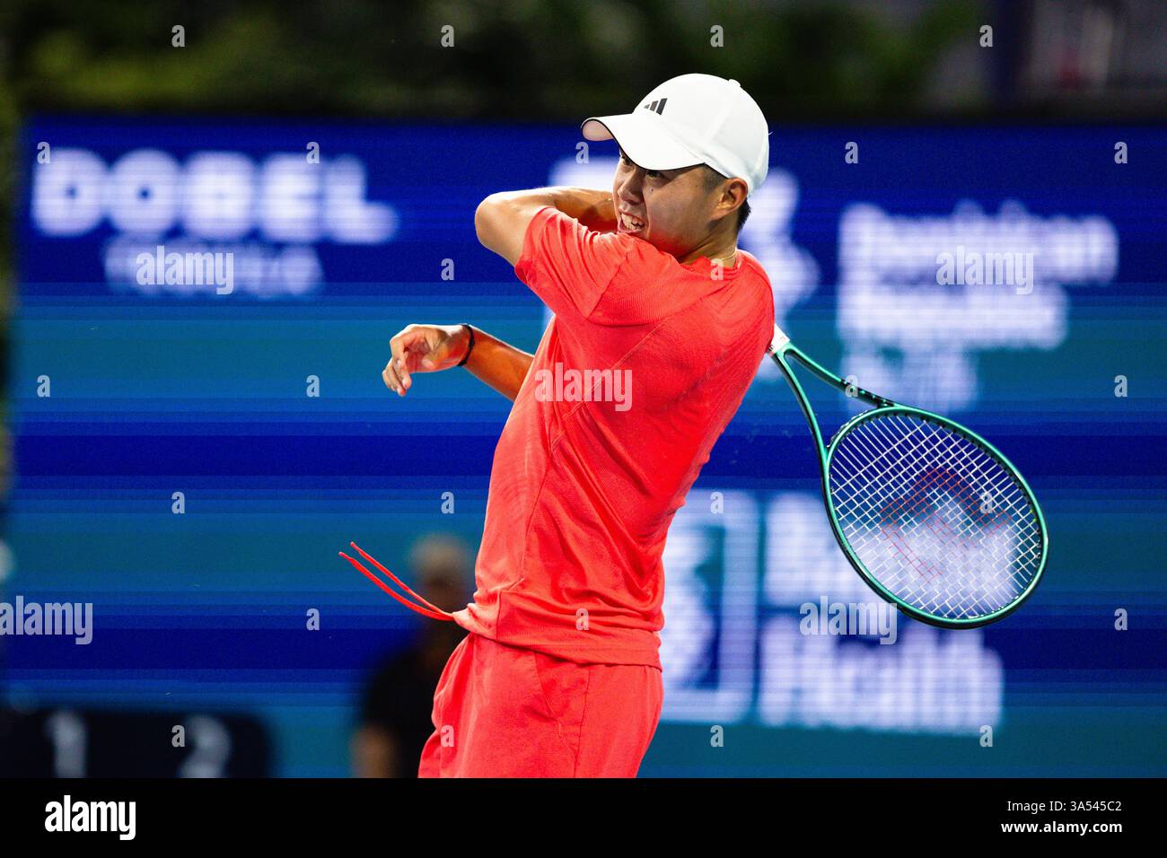 MIAMI GARDENS, FLORIDA - MARCH 20: Learner Tien of USA returns a shot ...