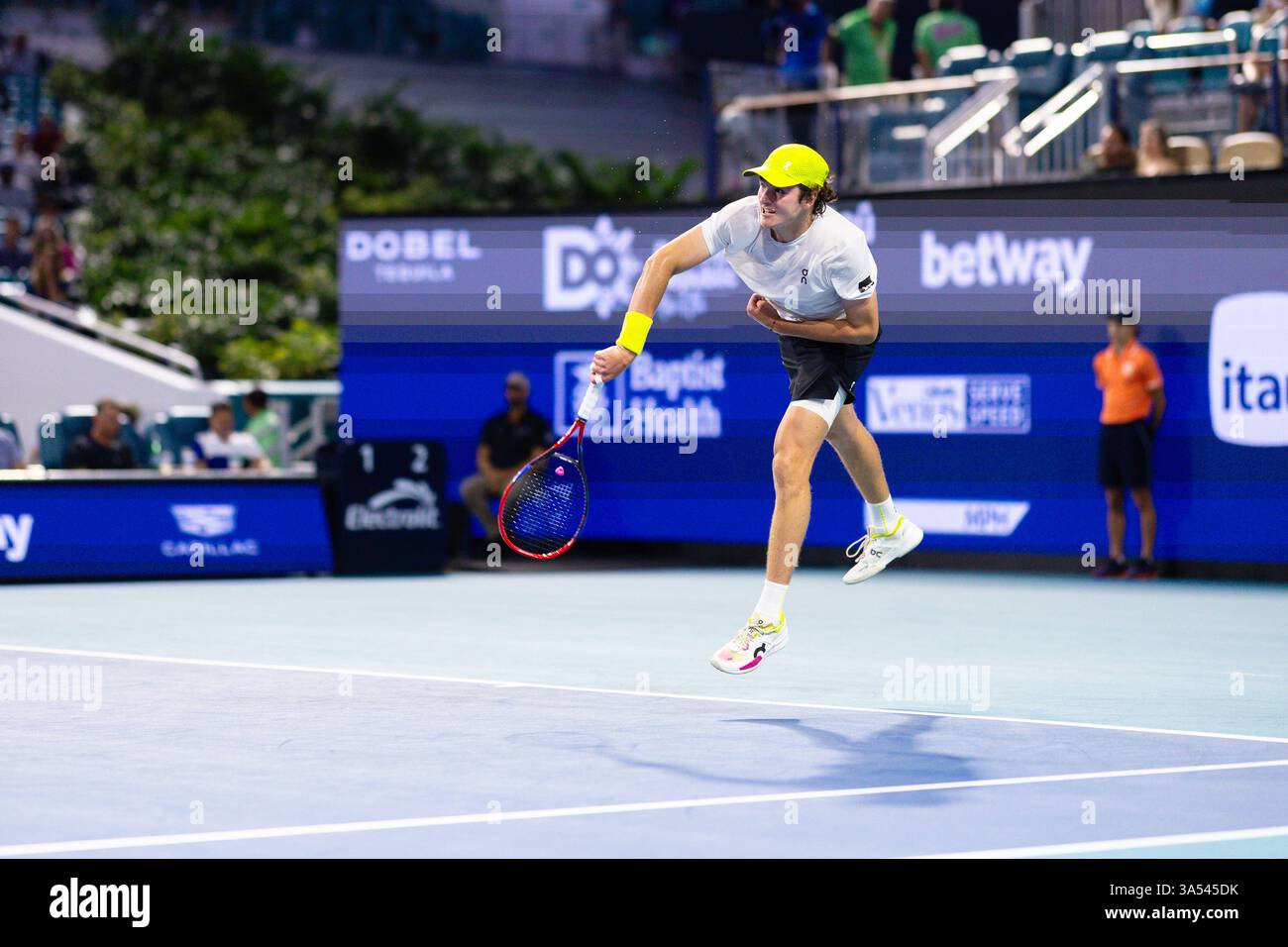 MIAMI GARDENS, FLORIDA - MARCH 20: Joao Fonseca of Brazil serves ...