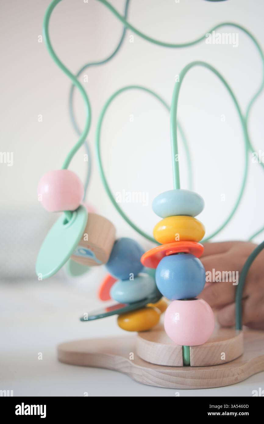 Colorful wooden bead maze offers playful learning for children Stock ...