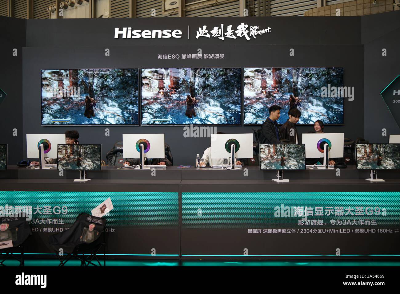 Visitors visit high-end display devices displayed at Hisense's booth at ...