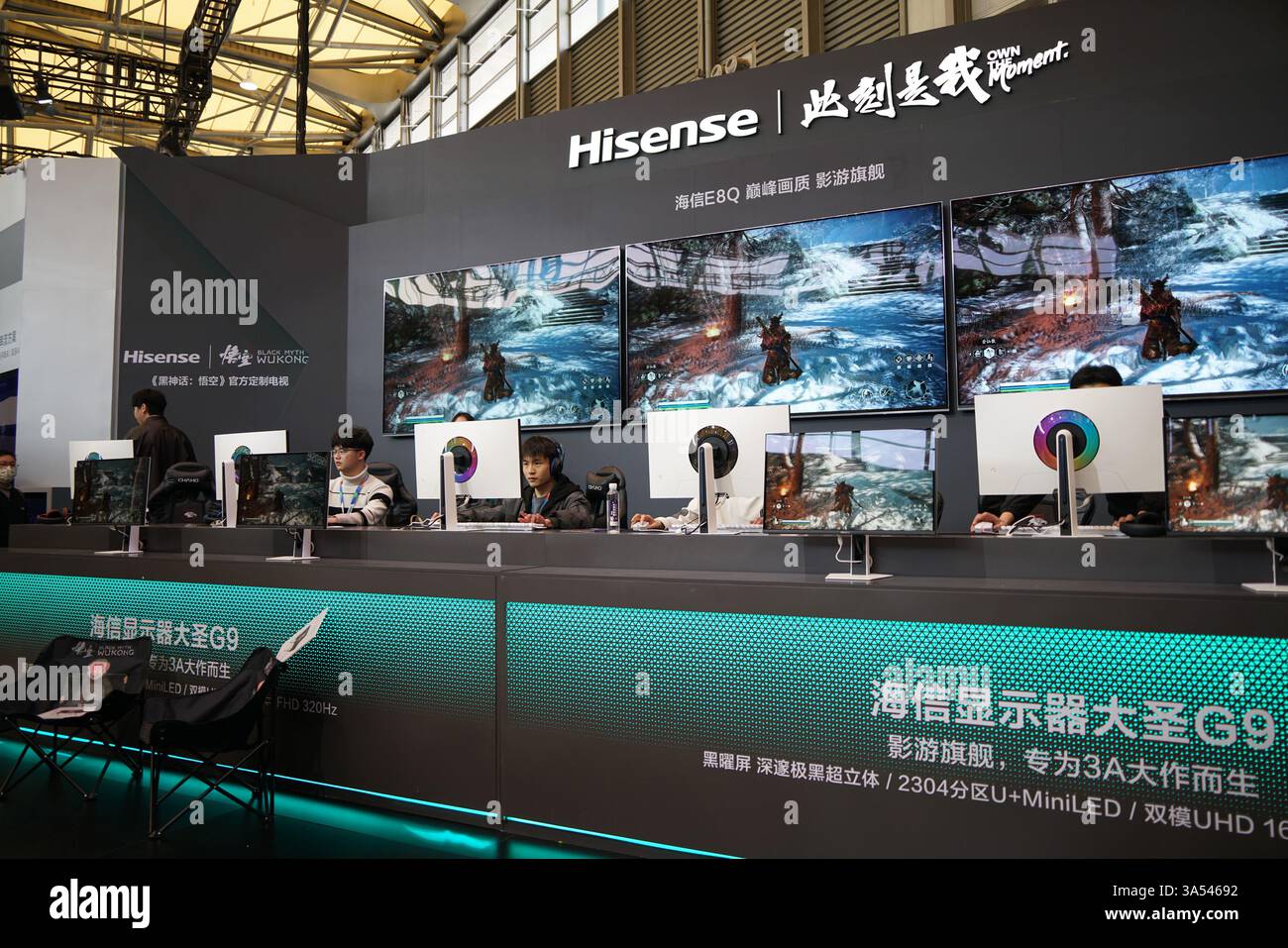 Visitors visit high-end display devices displayed at Hisense's booth at ...