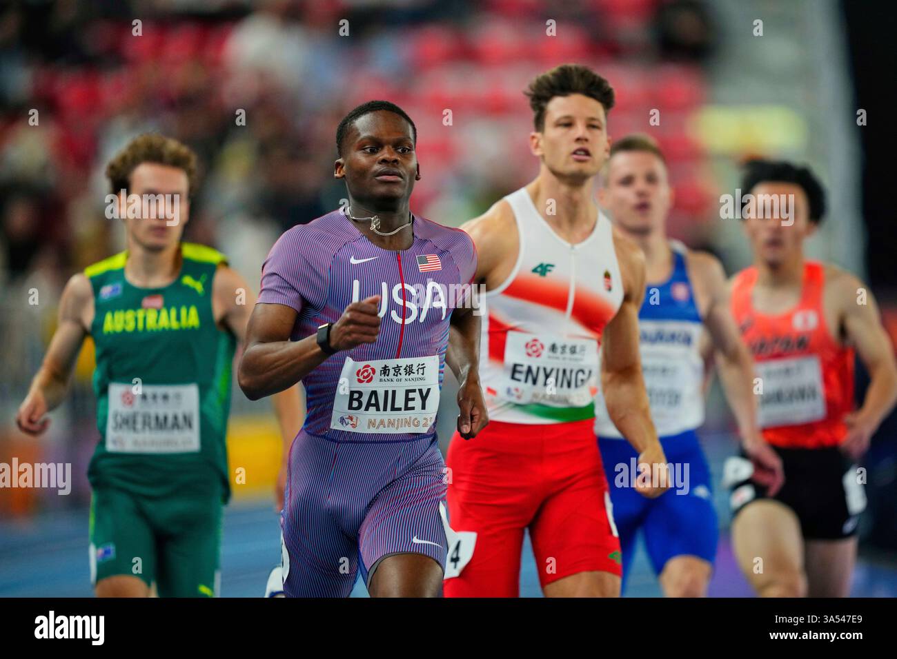 Christopher Bailey of the United States, second left, runs ahead to ...