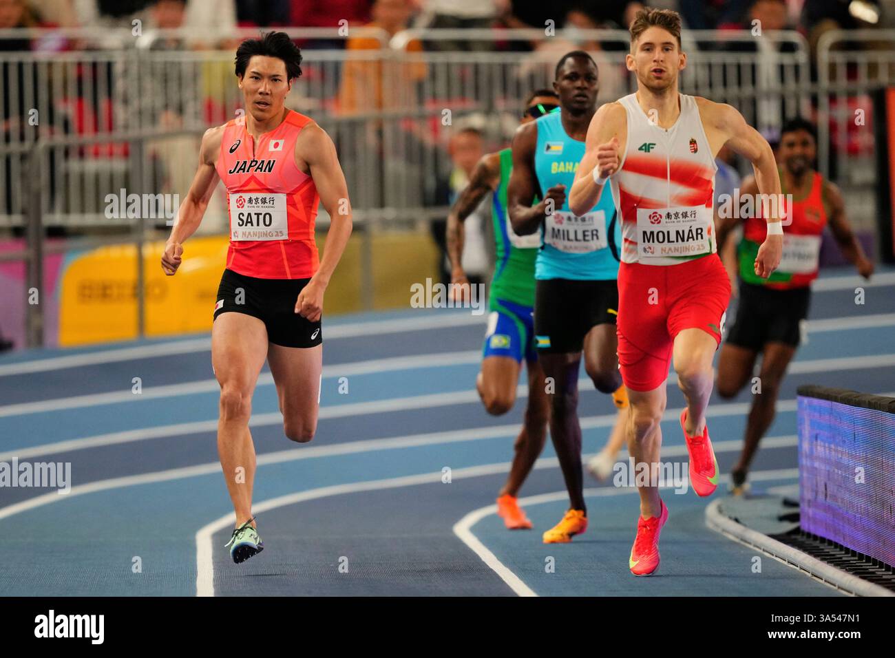 Fuga Sato of Japan, left, competes in 400 meters men's heats during the ...