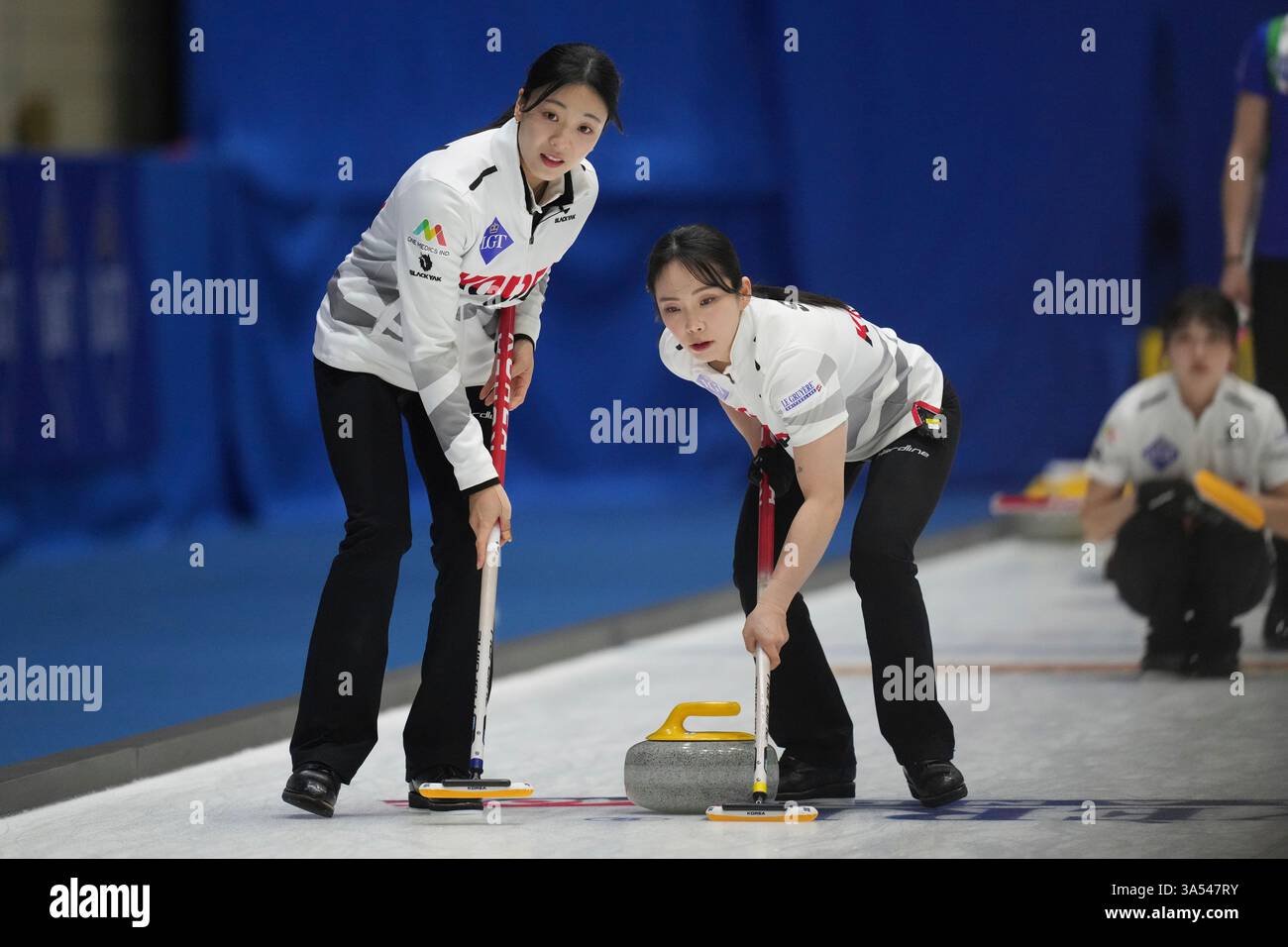 South Korea's Kim Min-ji and Kim Su-ji sweep during the match against ...