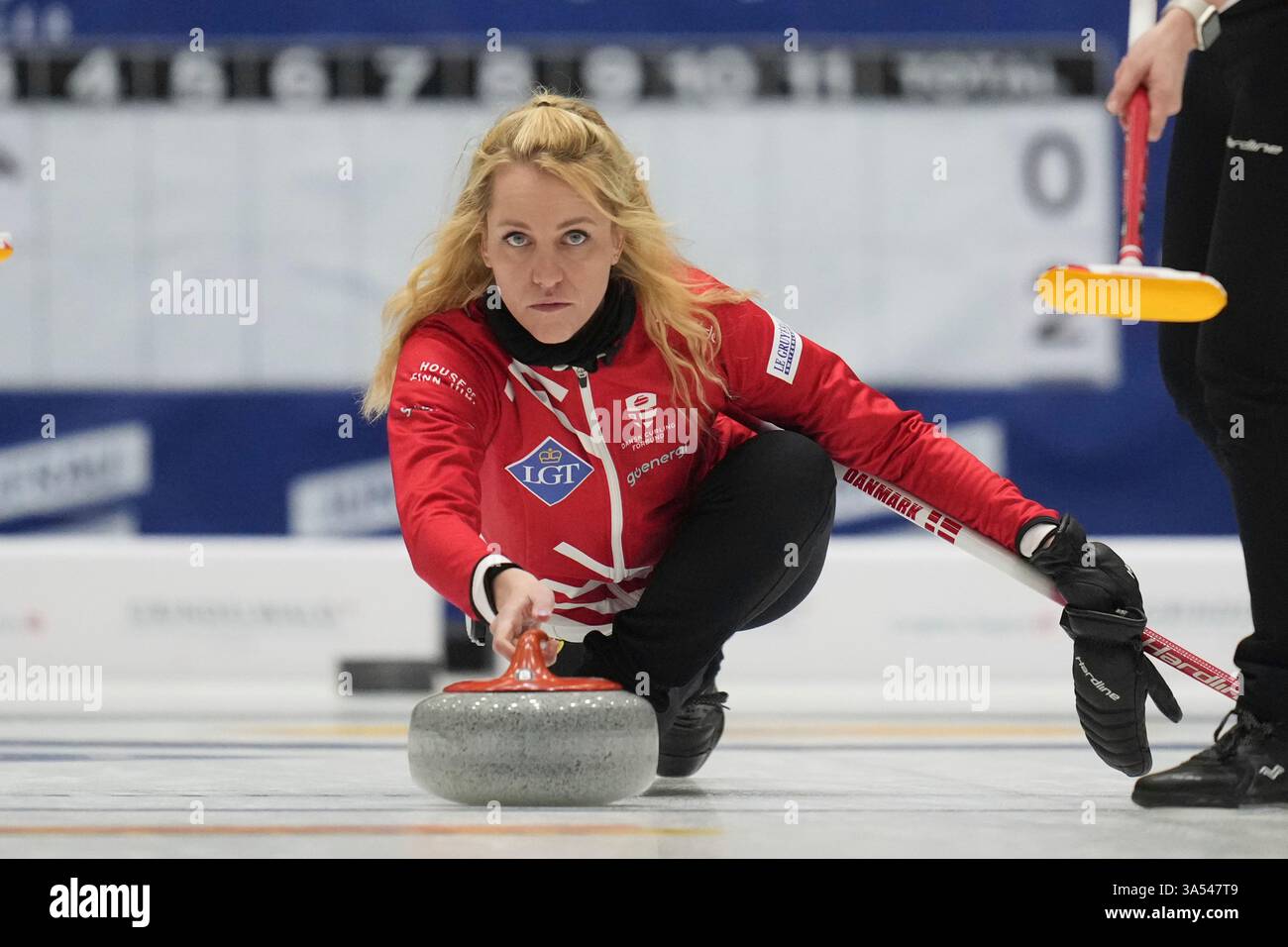 Denmark's skip Madeleine Dupont releases the stone during the match ...
