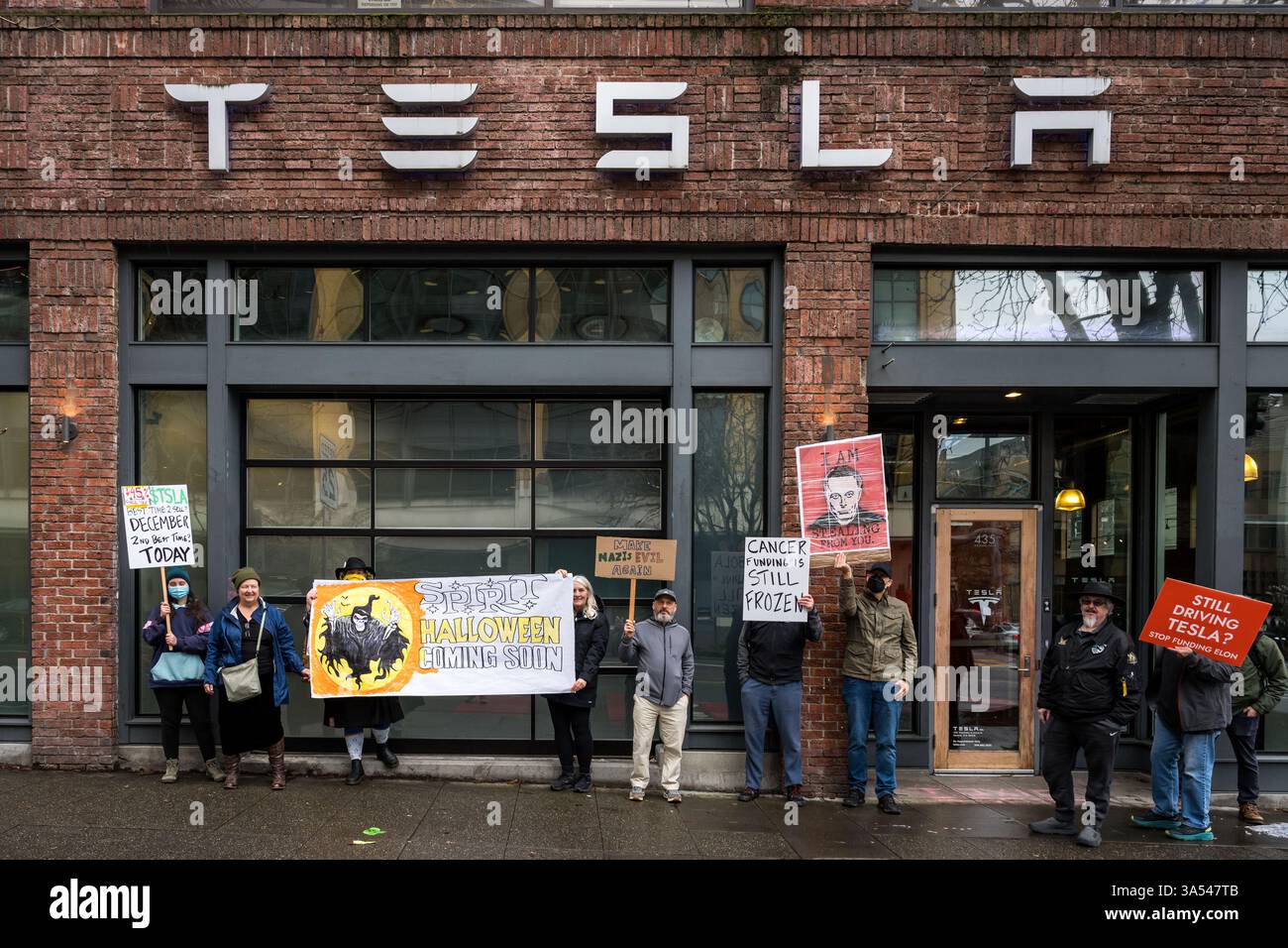 Seattle, USA. 20th Mar 2025. Tesla protestors back again at the South ...
