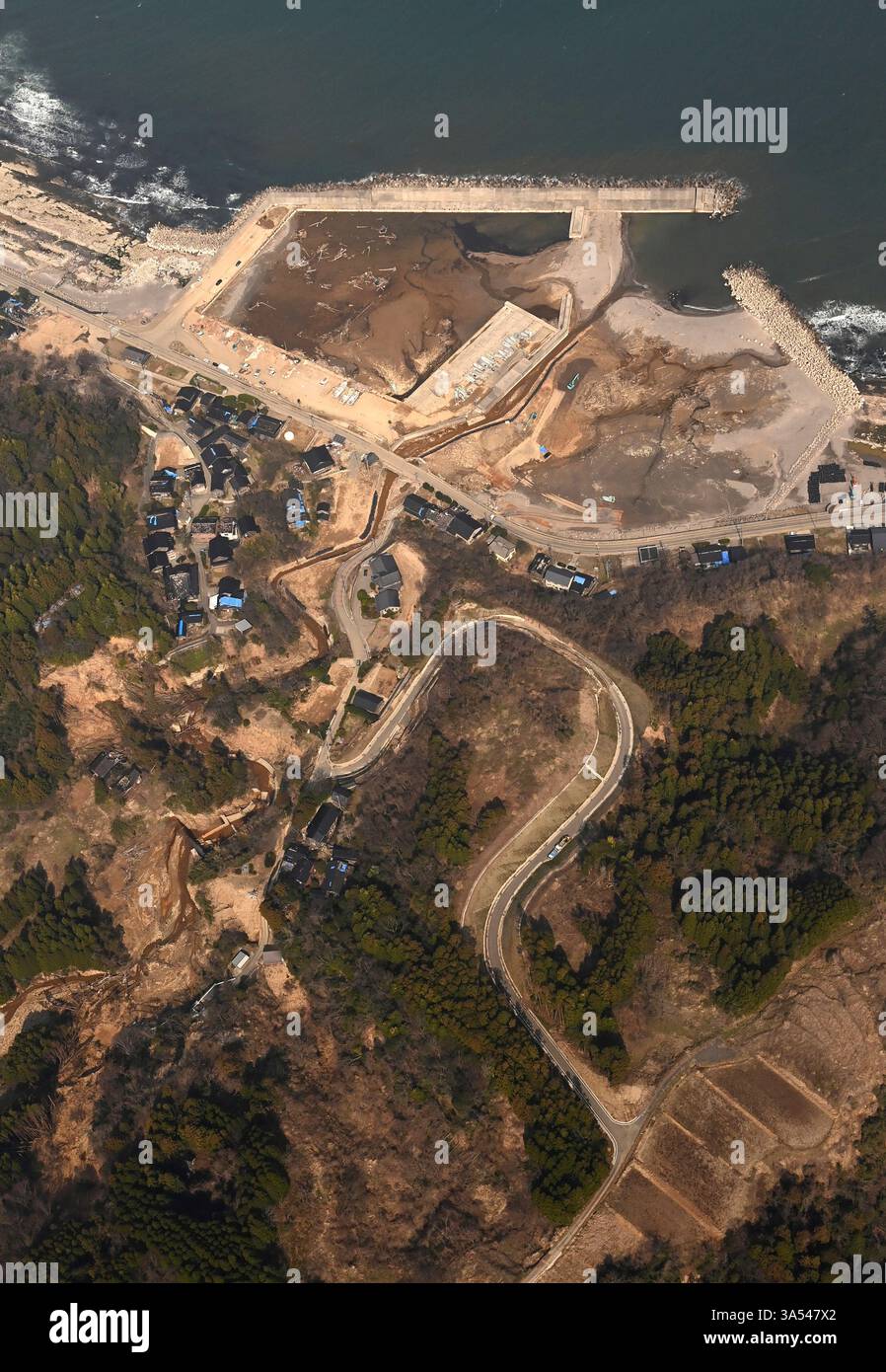 An aerial photo shows at the Nafune fishing port in Wajima City ...