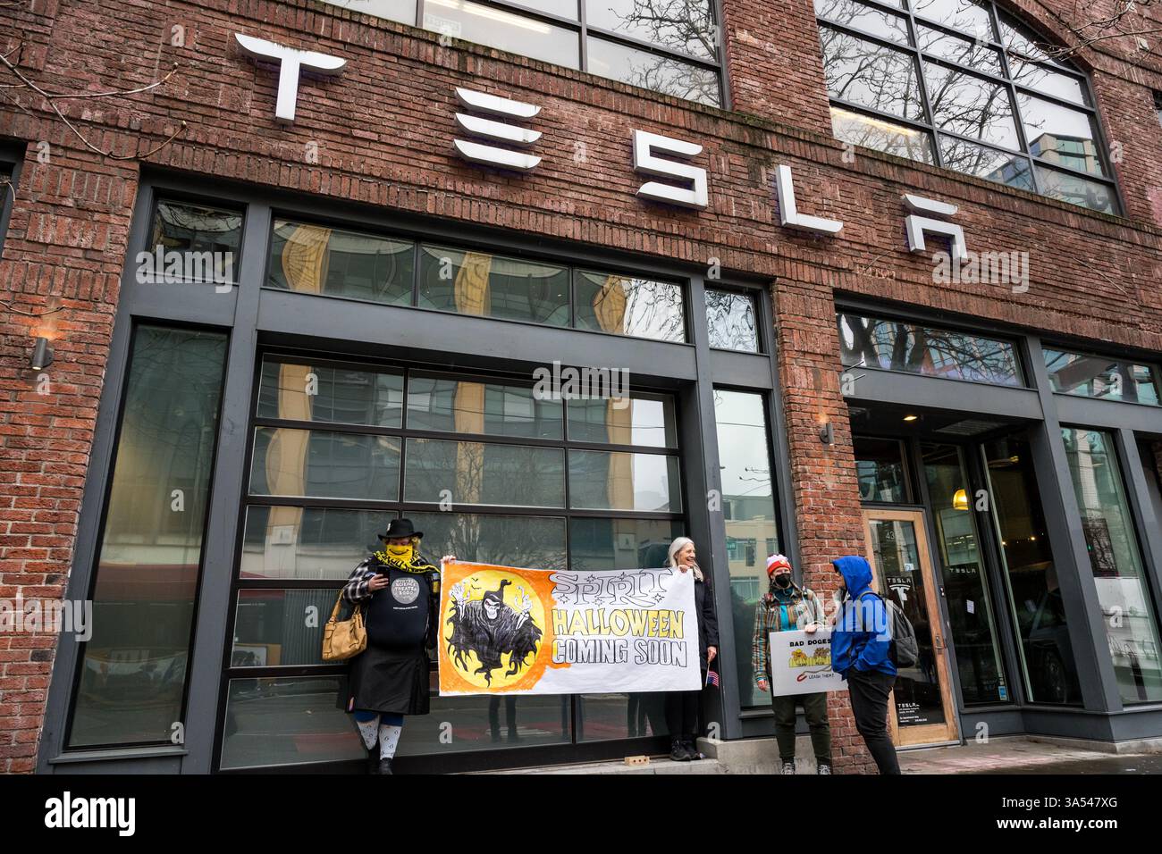 Seattle, USA. 20th Mar 2025. Tesla protestors back again at the South ...