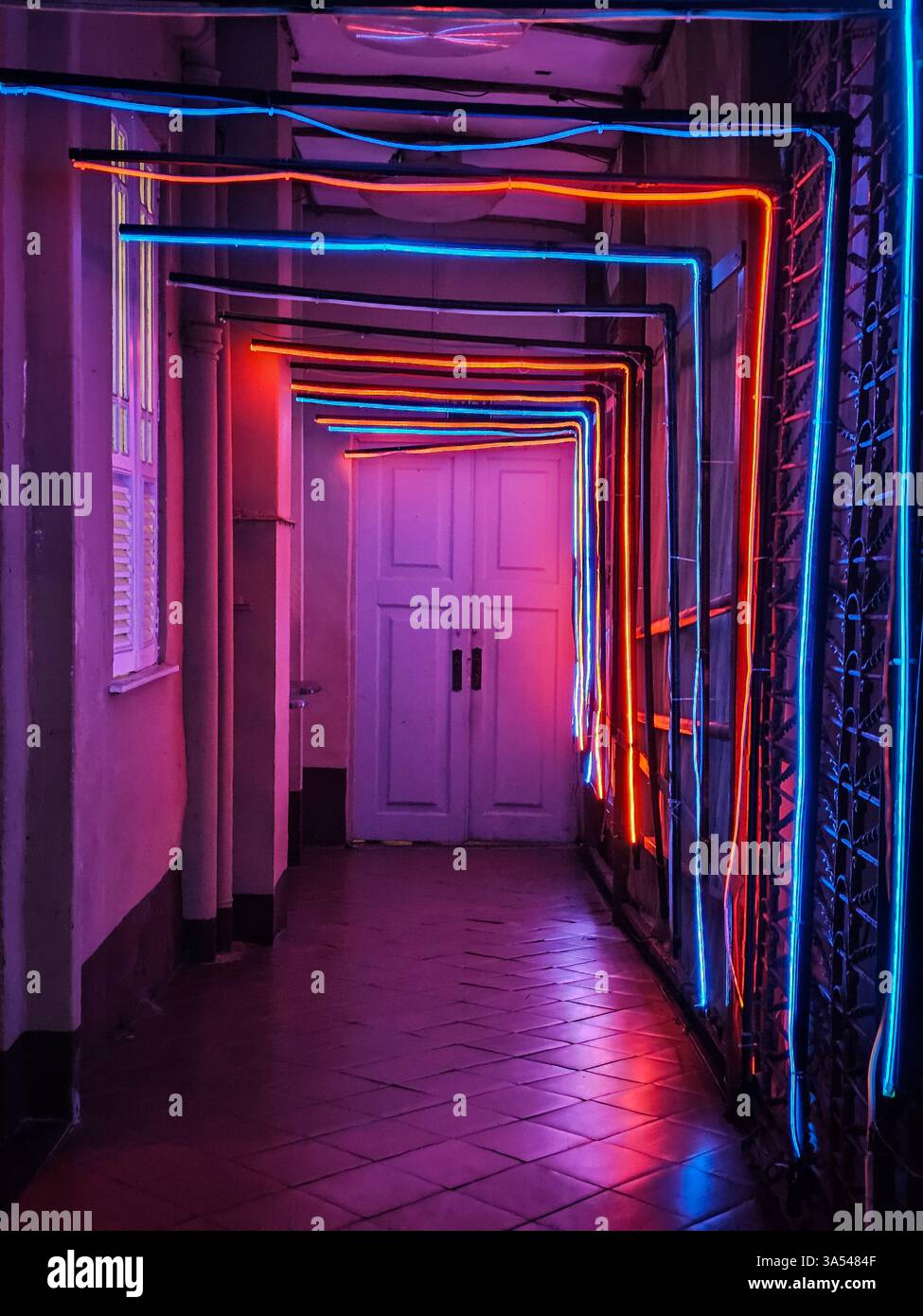 Neon Light Corridor with Red and Blue Installation Stock Photo - Alamy