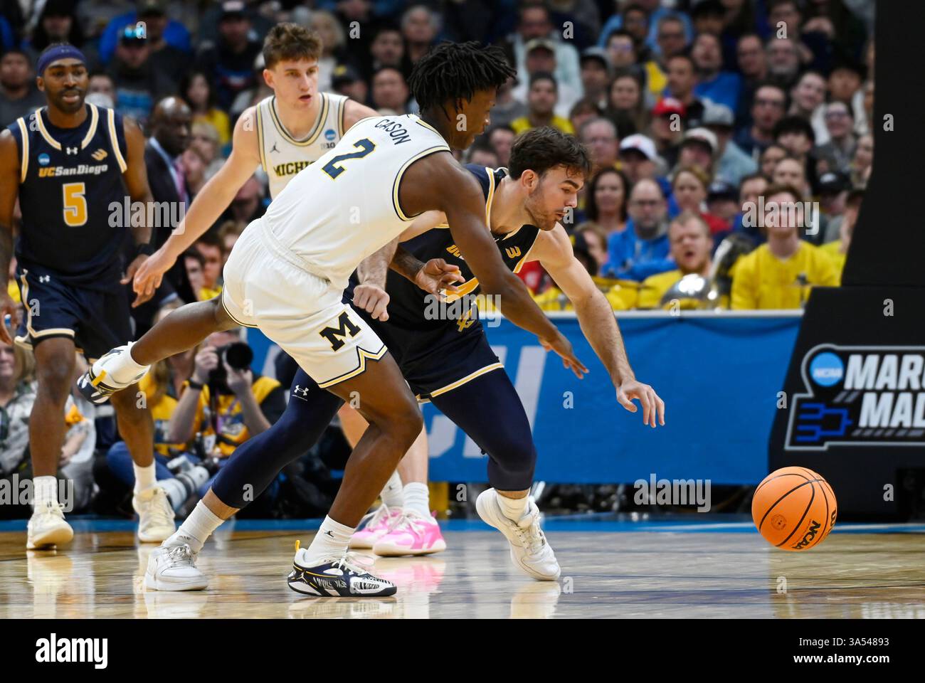 Michigan guard L.J. Cason (2) pursues the ball with UC San Diego ...