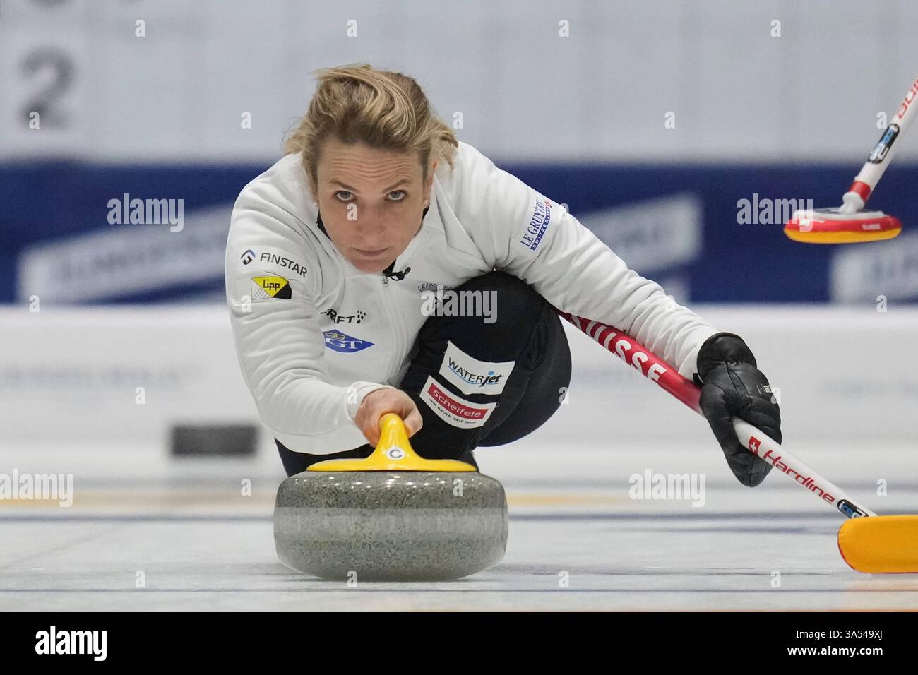 Switzerland's skip Silvana Tirinzoni, releases the stone during the match against Sweden at the ...