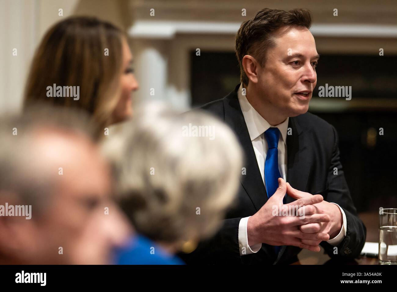 Elon Musk speaking during a meeting with President Donald Trump and his ...
