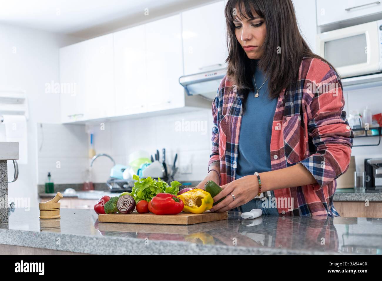 Preparing fresh salad ingredients carefully hi-res stock photography ...