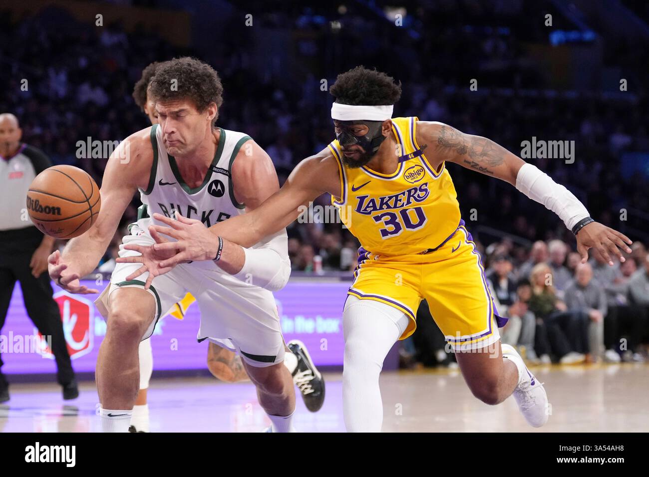 Milwaukee Bucks center Brook Lopez, left, and Los Angeles Lakers guard ...