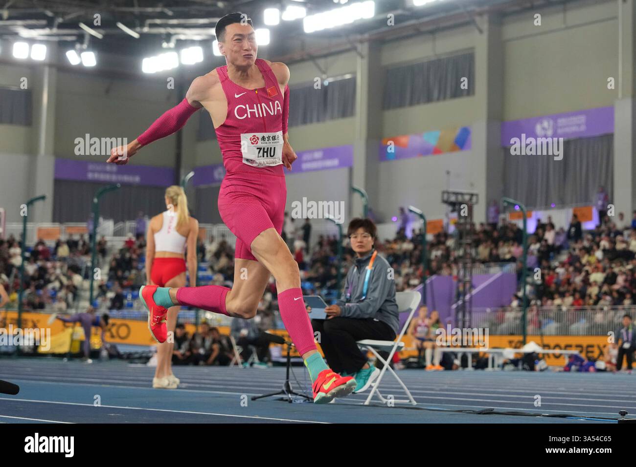 Yaming Zhu of China competes in men's triple jump during the World ...