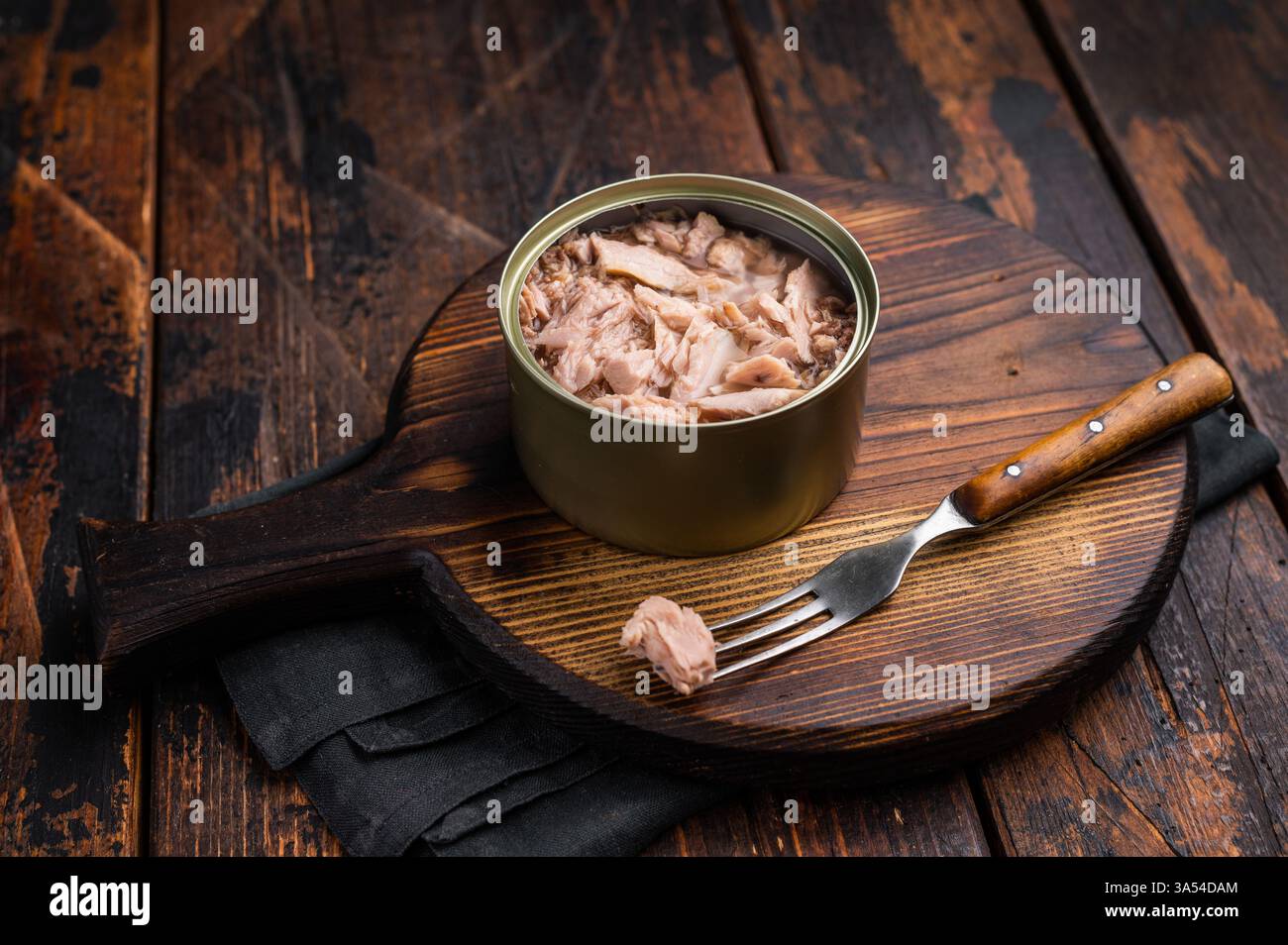 Freshly opened tinned canned tuna, showcasing its rich texture and ...