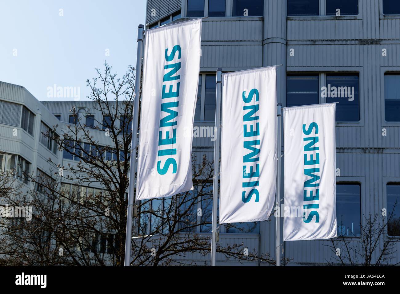Munich, Germany. 20th Mar, 2025. The Siemens lettering and logo can be seen on flags in front of ...