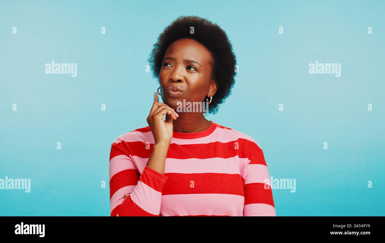 Thinking, studio and face of black woman with doubt for choice ...