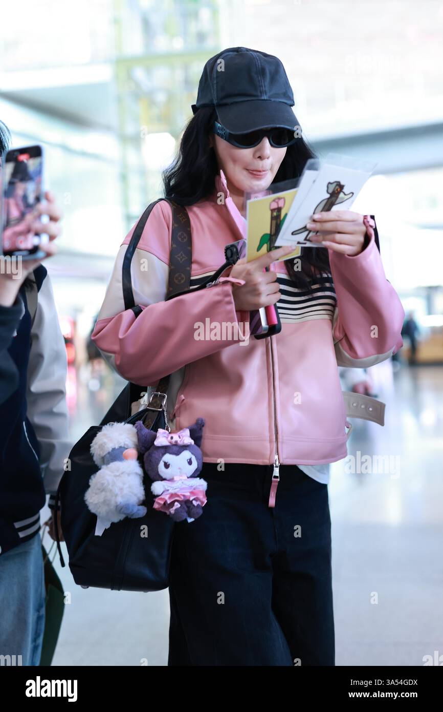 Chinese actress and host Peng Xiaoran appears at the airport in Beijing ...
