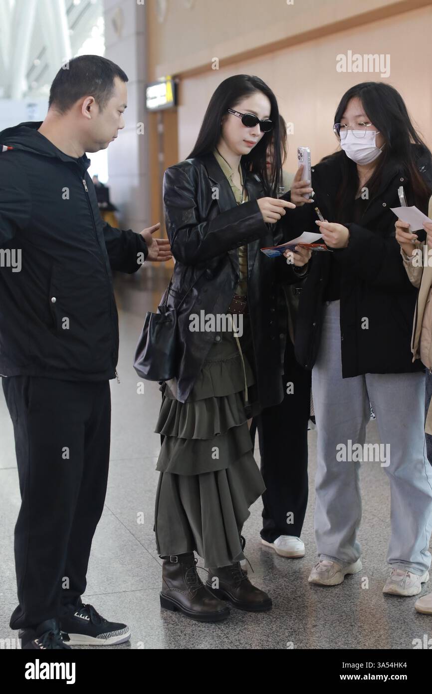 Chinese actress and singer Jiang Yiyan appears at the airport in Changsha City, south China's ...