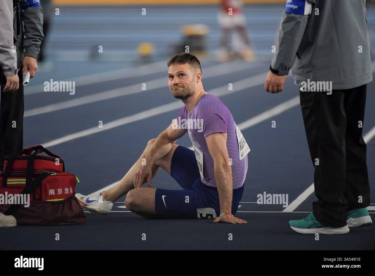 Andrew Robertson of Great Britain pulls up injured in the 60 meters ...