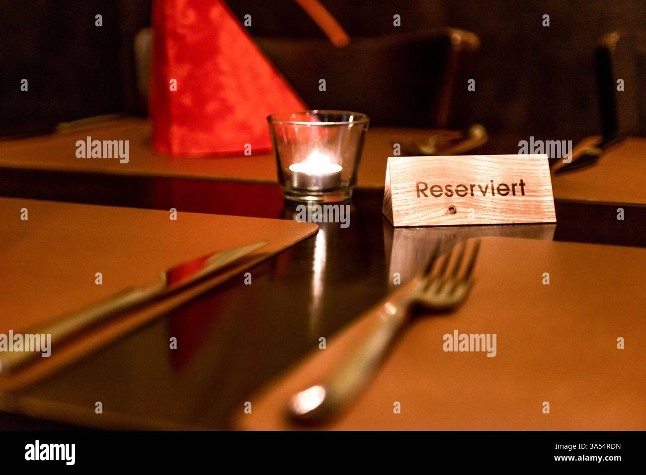 German Reserved sign label on the table of restaurant in an Germany ...