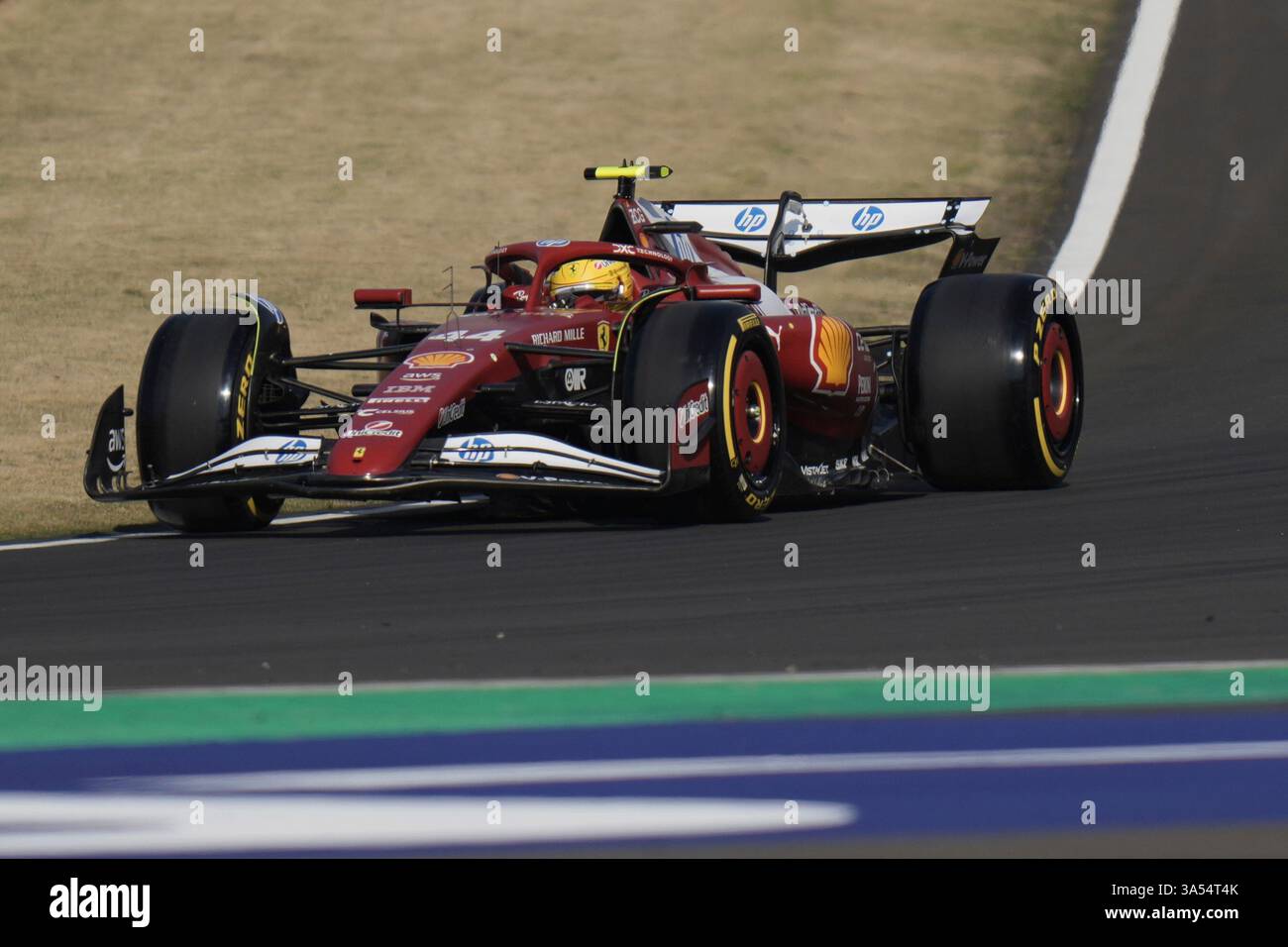 Ferrari driver Lewis Hamilton of Britain steers his car during the ...