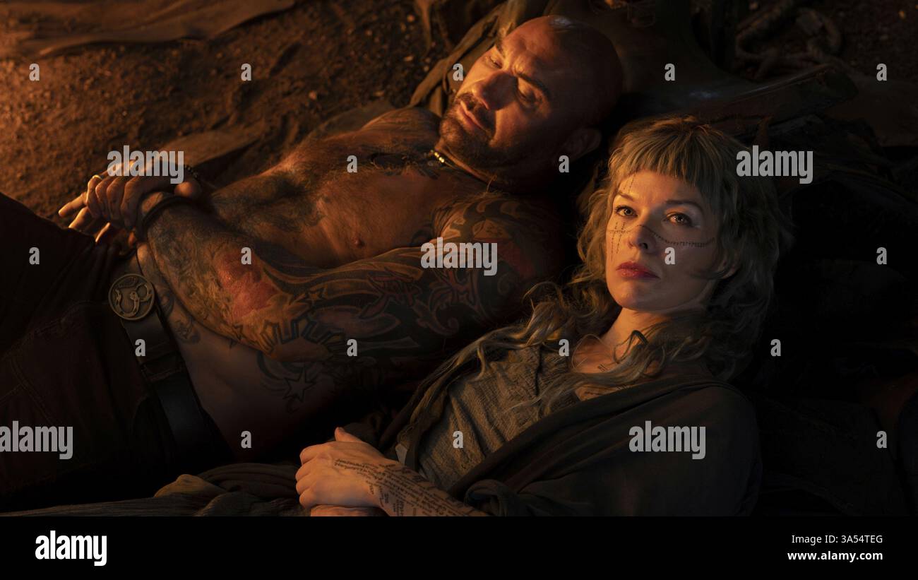 In the Lost Lands Milla Jovovich & Dave Bautista Stock Photo - Alamy