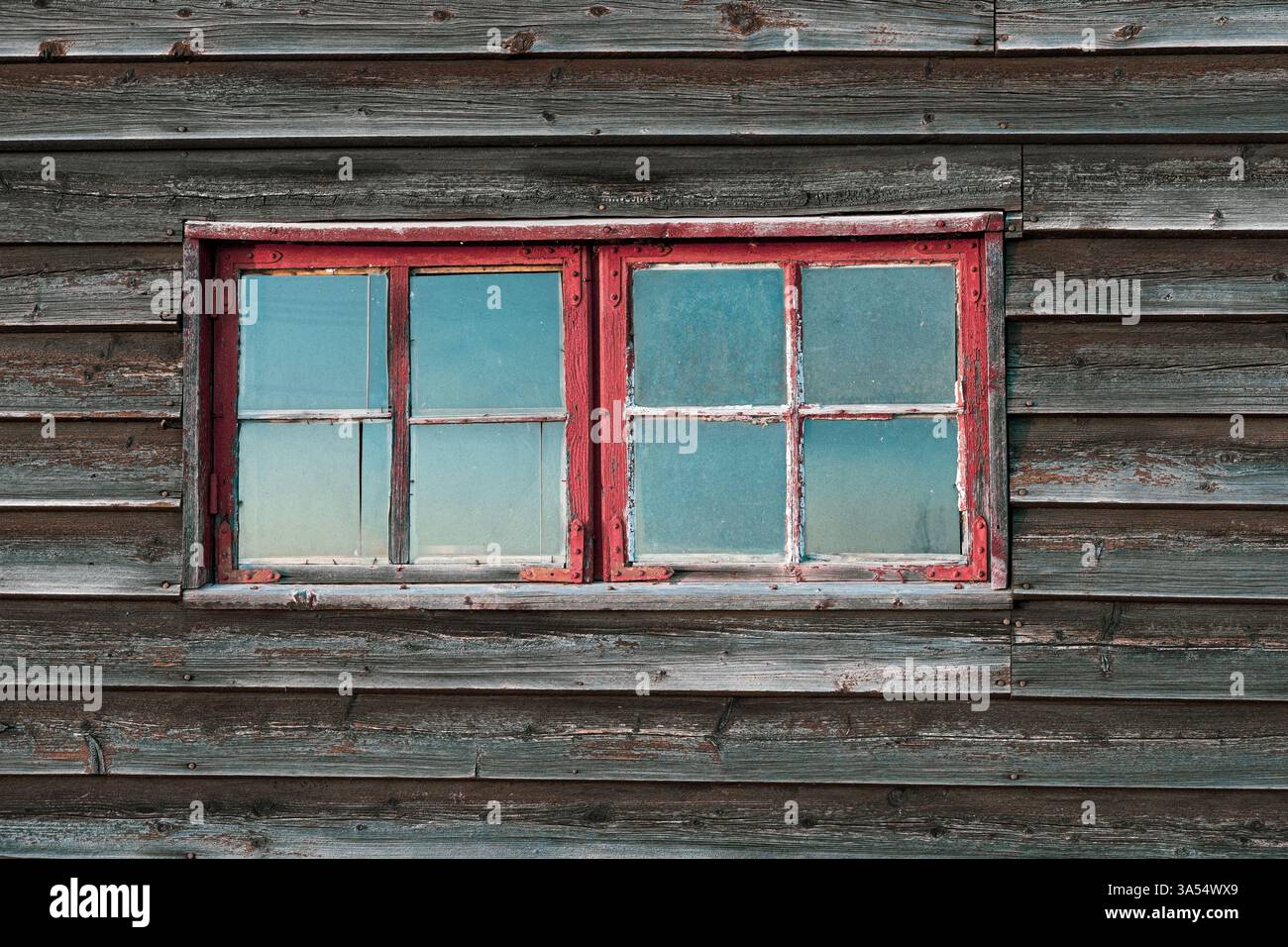 old routed vernacular window of a barn wall Stock Photo - Alamy