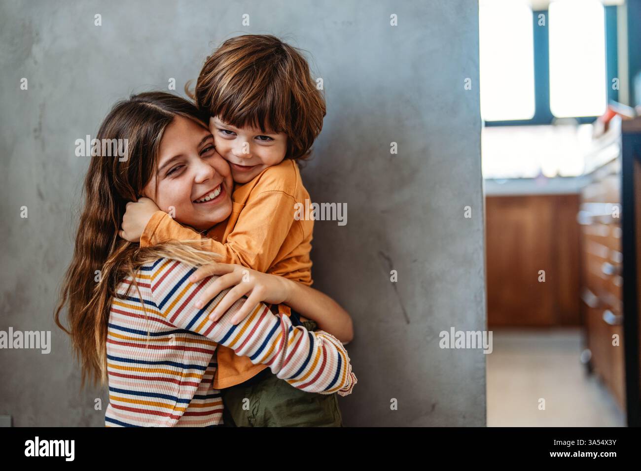 Happy siblings hugging, feeling love and connection, kid girl sister ...