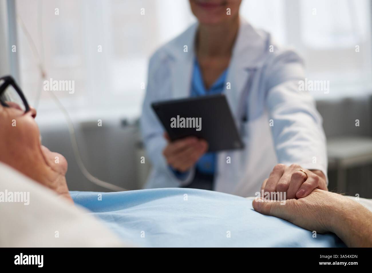Doctor Holding Patient's Hand Offering Compassionate Support Stock ...