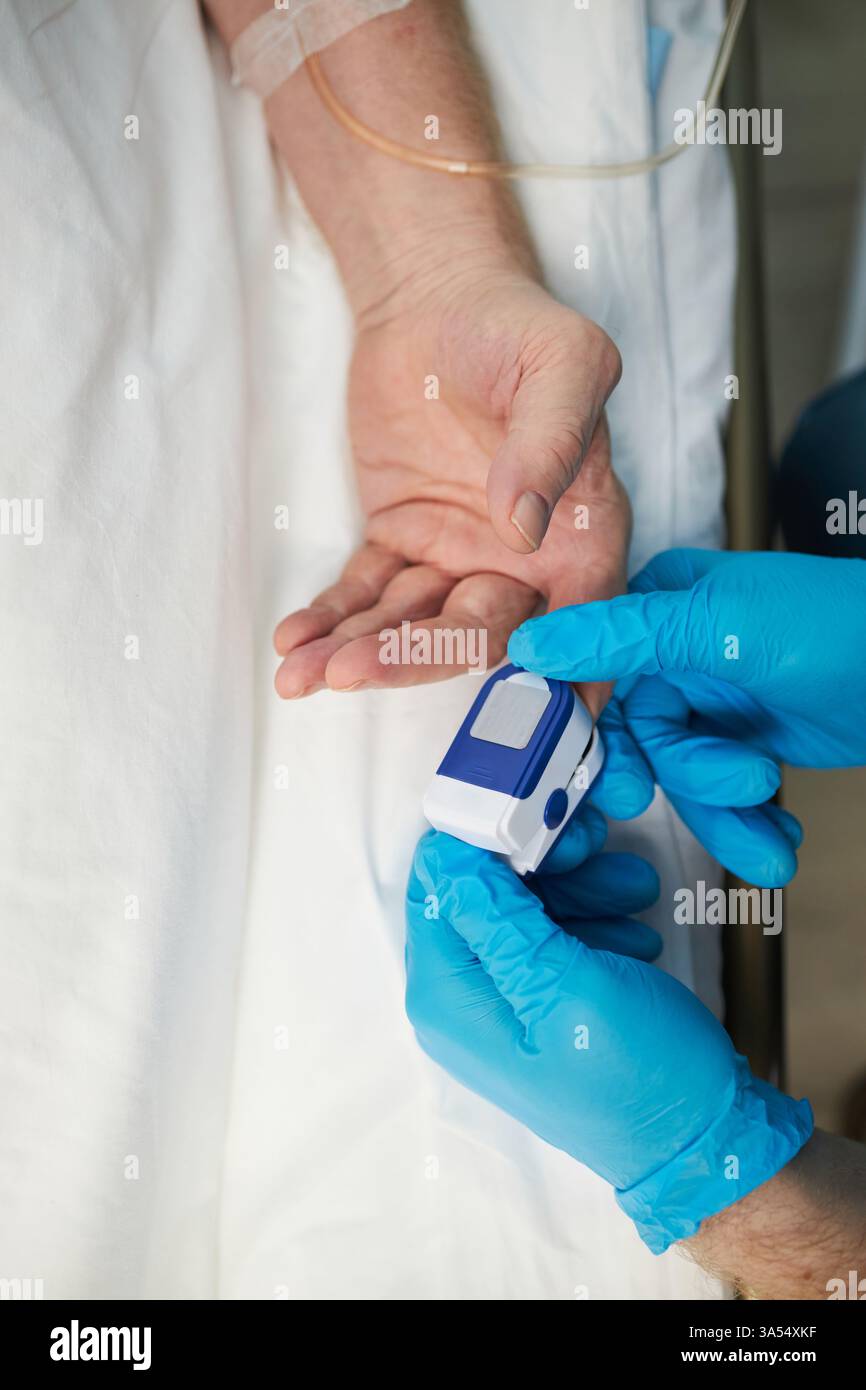 Monitoring Patient's Blood Oxygen Levels with Pulse Oximeter Stock ...
