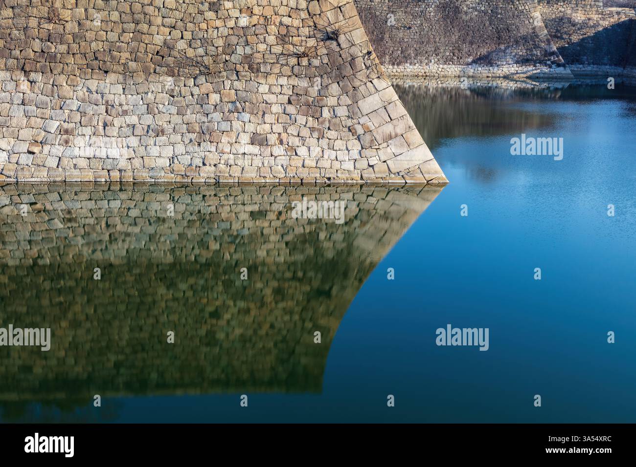Closeup of moat and stone wall at Osaka Castle in Osaka, Japan ...