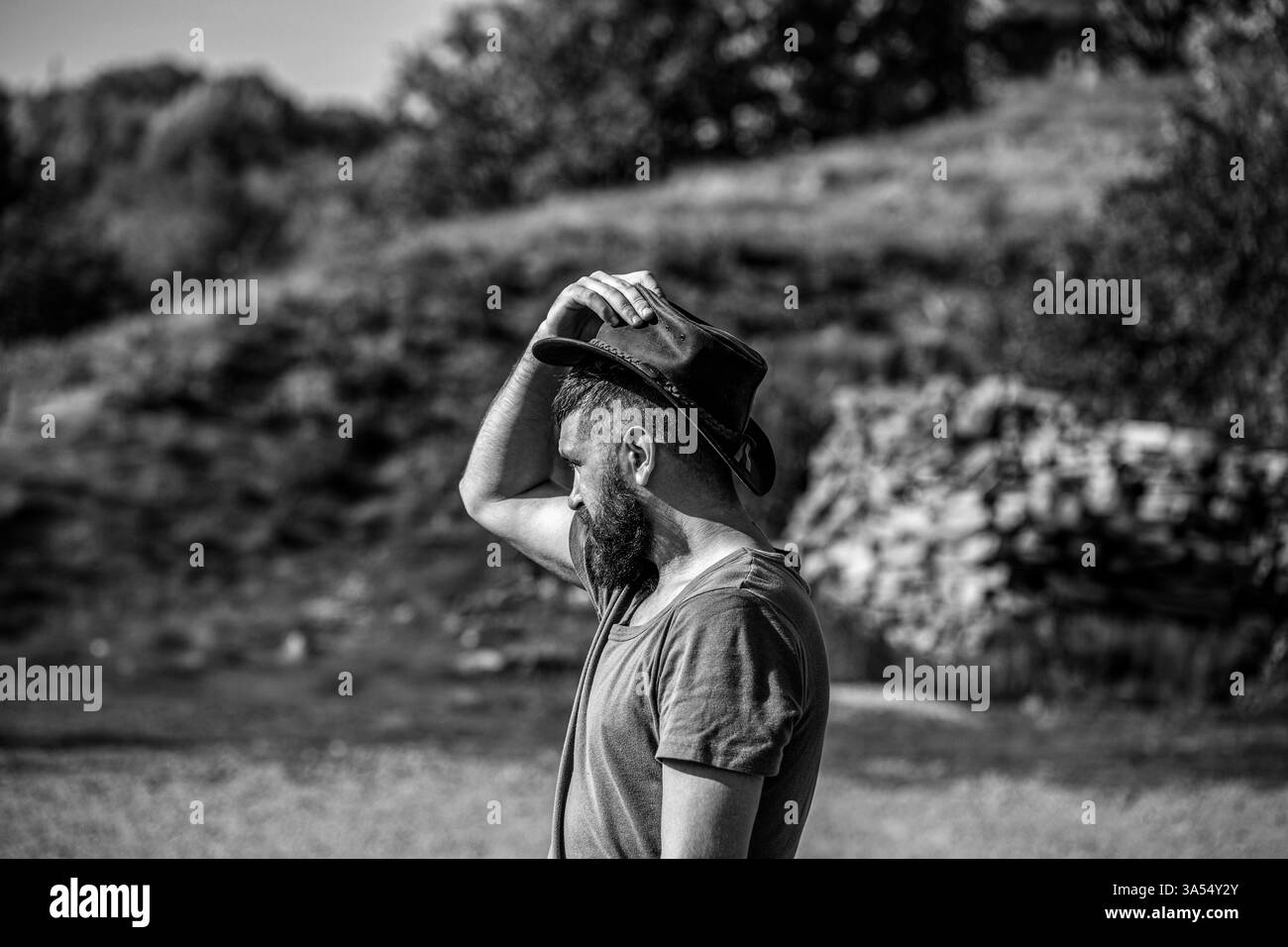 Cowboy hat. Portrait of young man wearing cowboy hat. Cowboys in hat ...