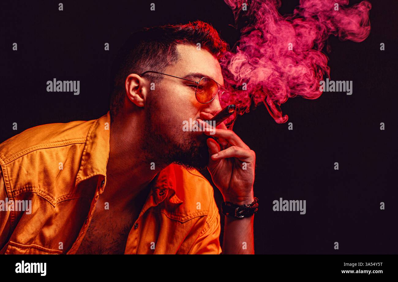 Smoke swirling around, capturing the burning. Man in glasses and ...