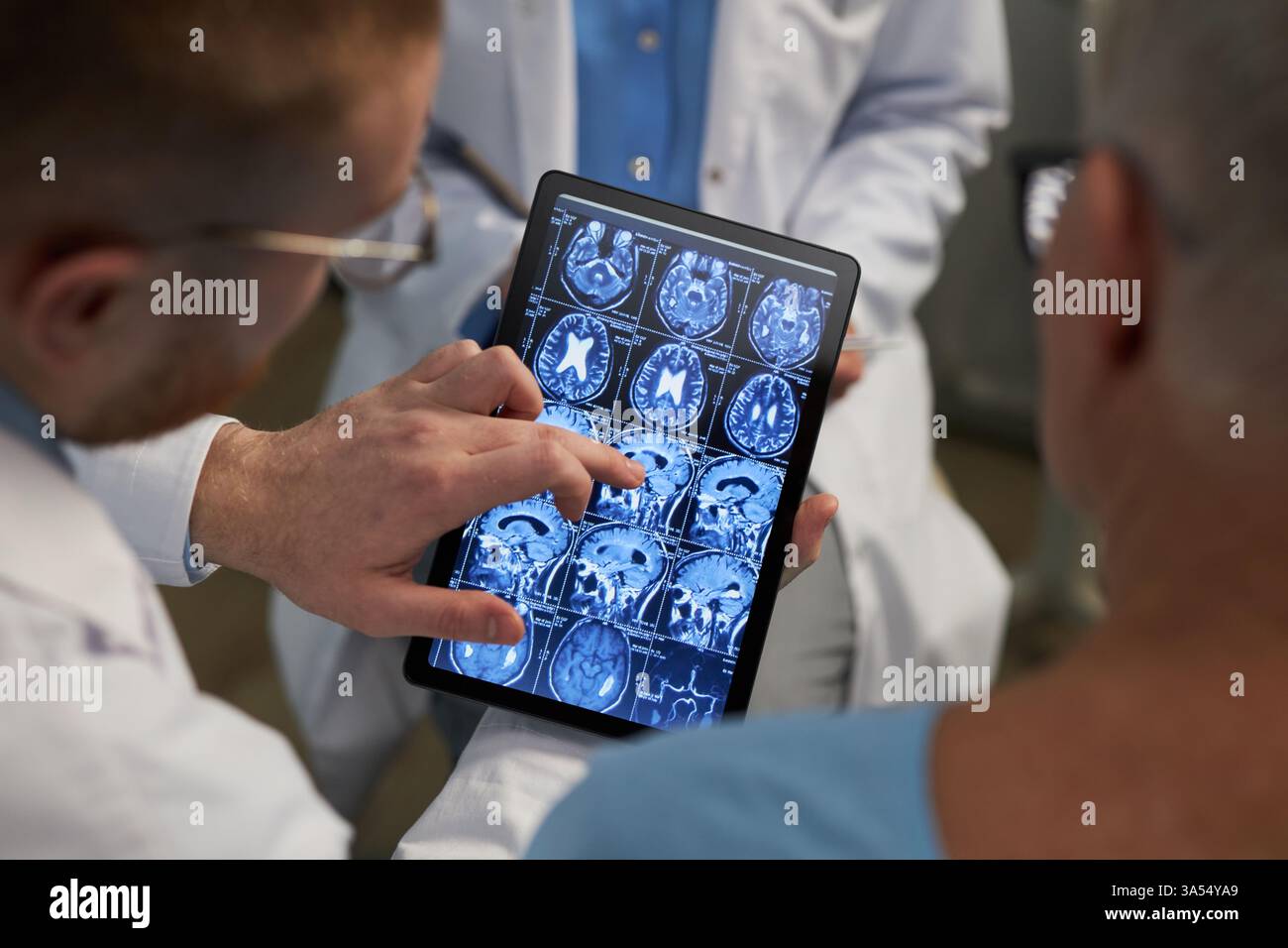 Medical professionals review mri scan hi-res stock photography and ...