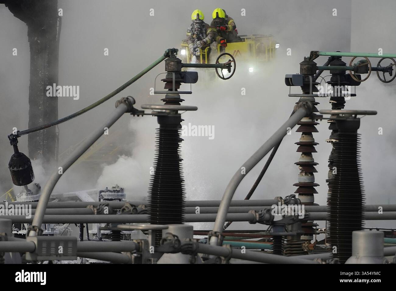 Firefighters extinguish the fire at the North Hyde electrical ...