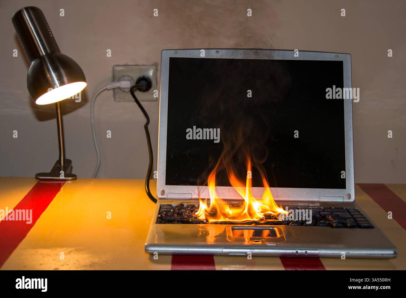 In the room on the table the laptop caught fire, the ignition of the ...