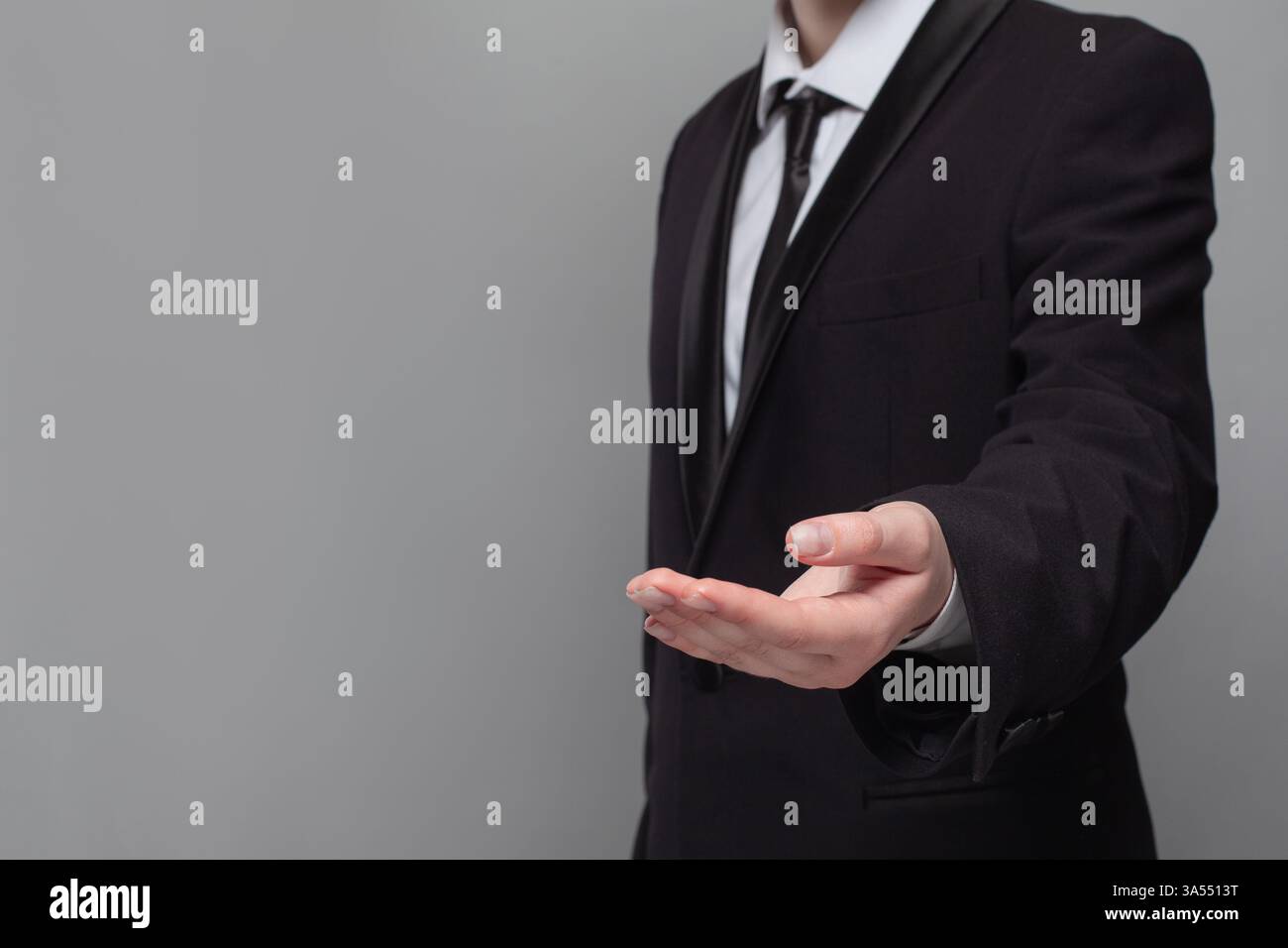 A young businessman extends his hand Stock Photo - Alamy