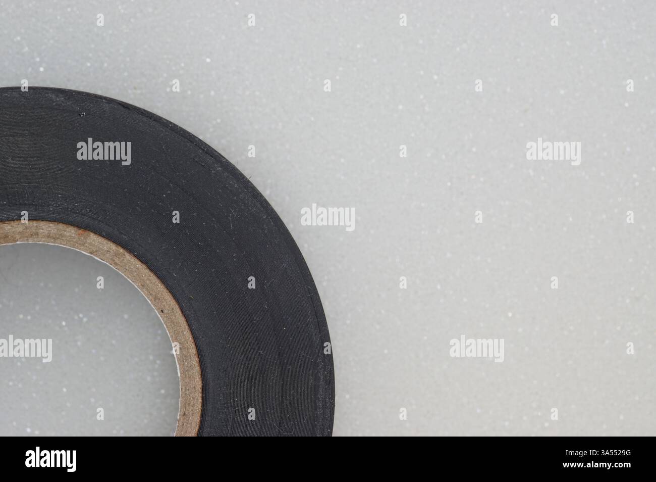 Roll of black tape with copy space Stock Photo - Alamy