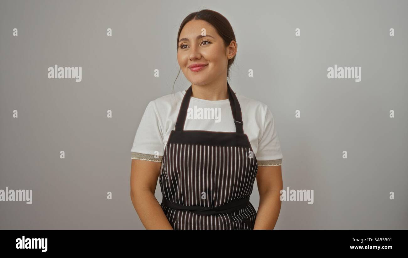 Young, attractive, hispanic, woman wearing a striped, apron standing ...