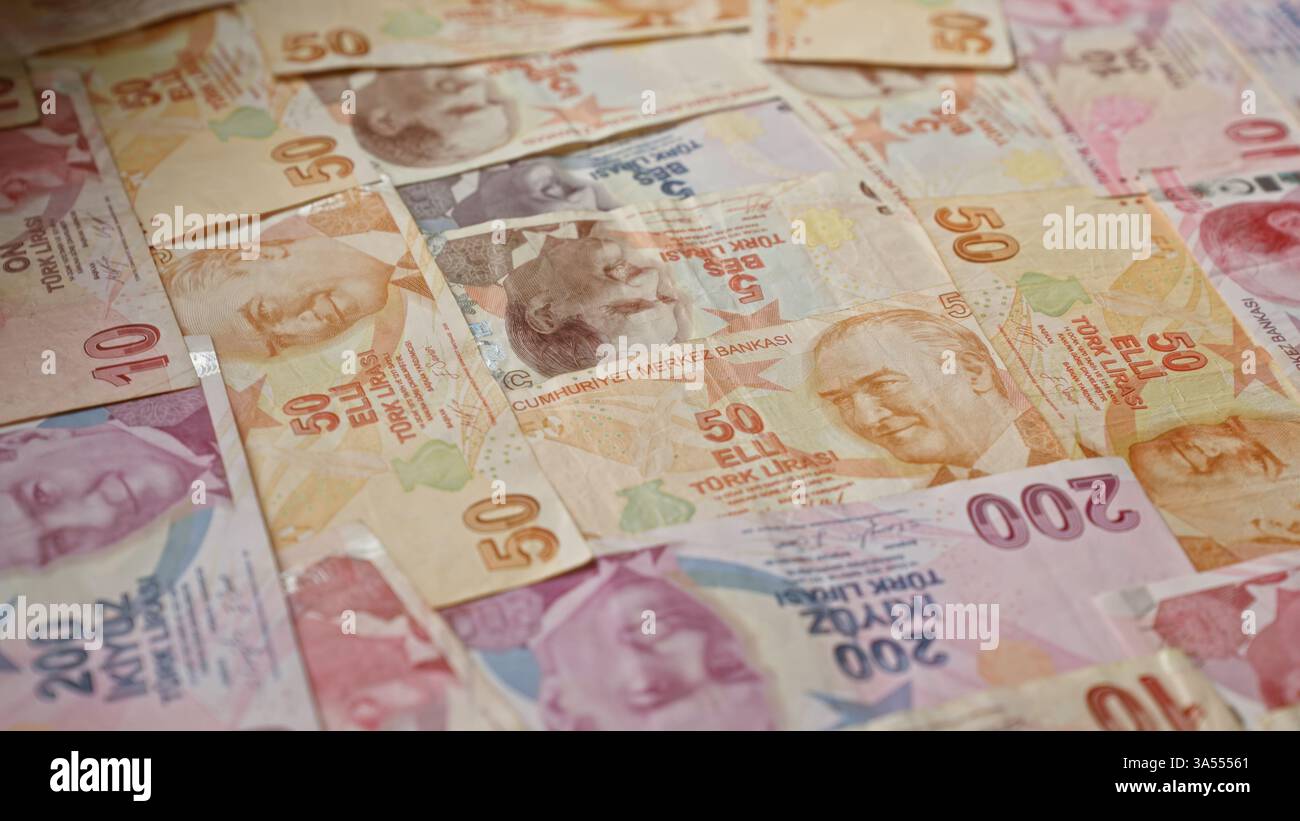 Turkish banknotes scattered showcasing various denominations of lira ...