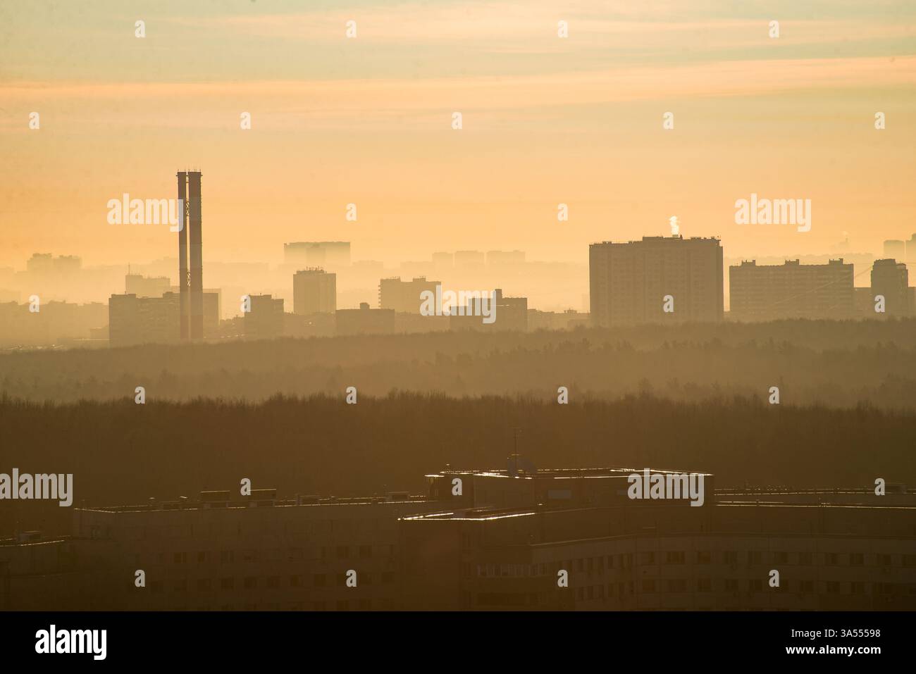 Air pollution in the city. Dust fog and smog. Misty sunrise in Moscow ...