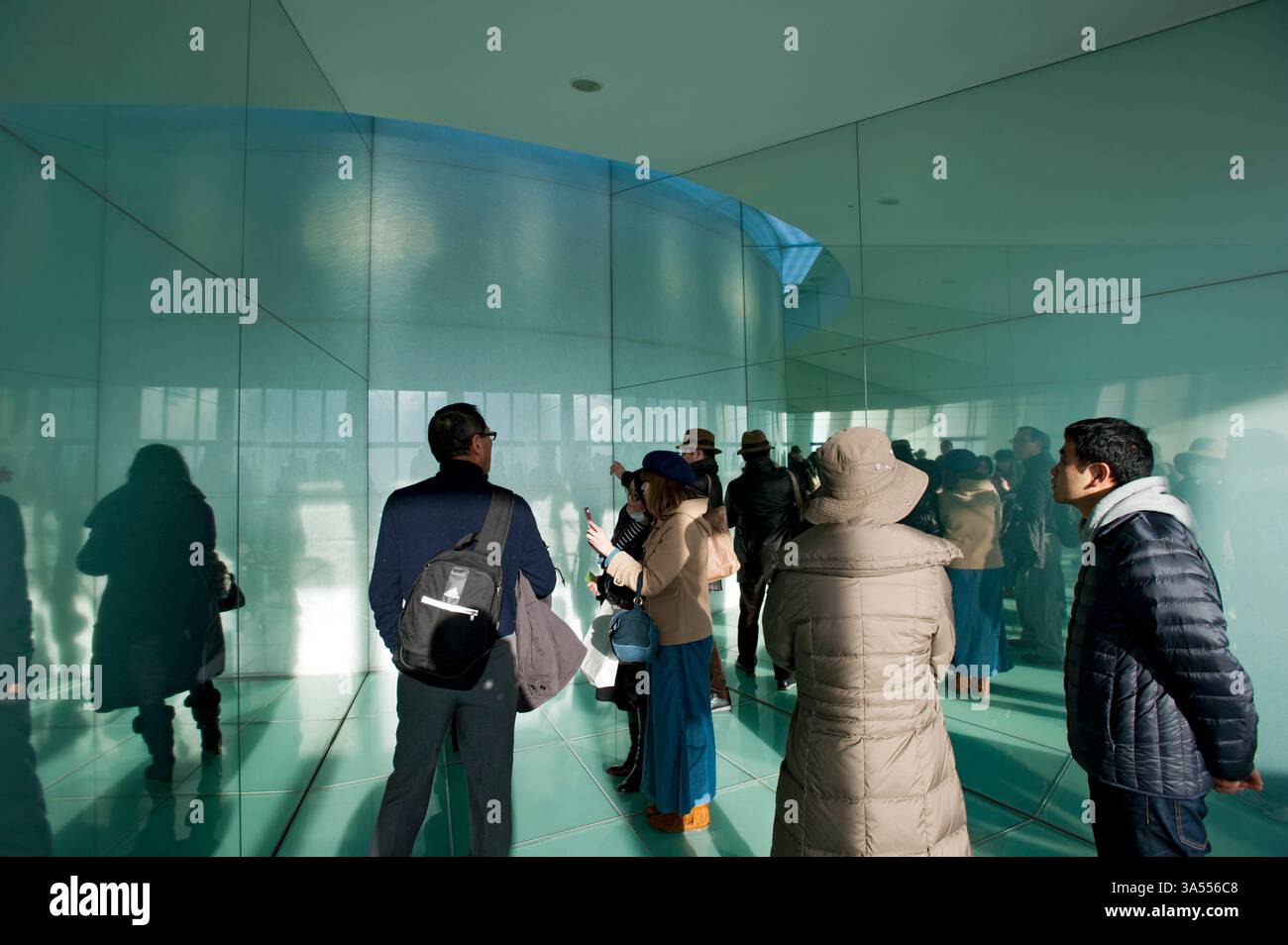 Visitors to the Tokyo Skytree enjoying the optical illusions inside the ...