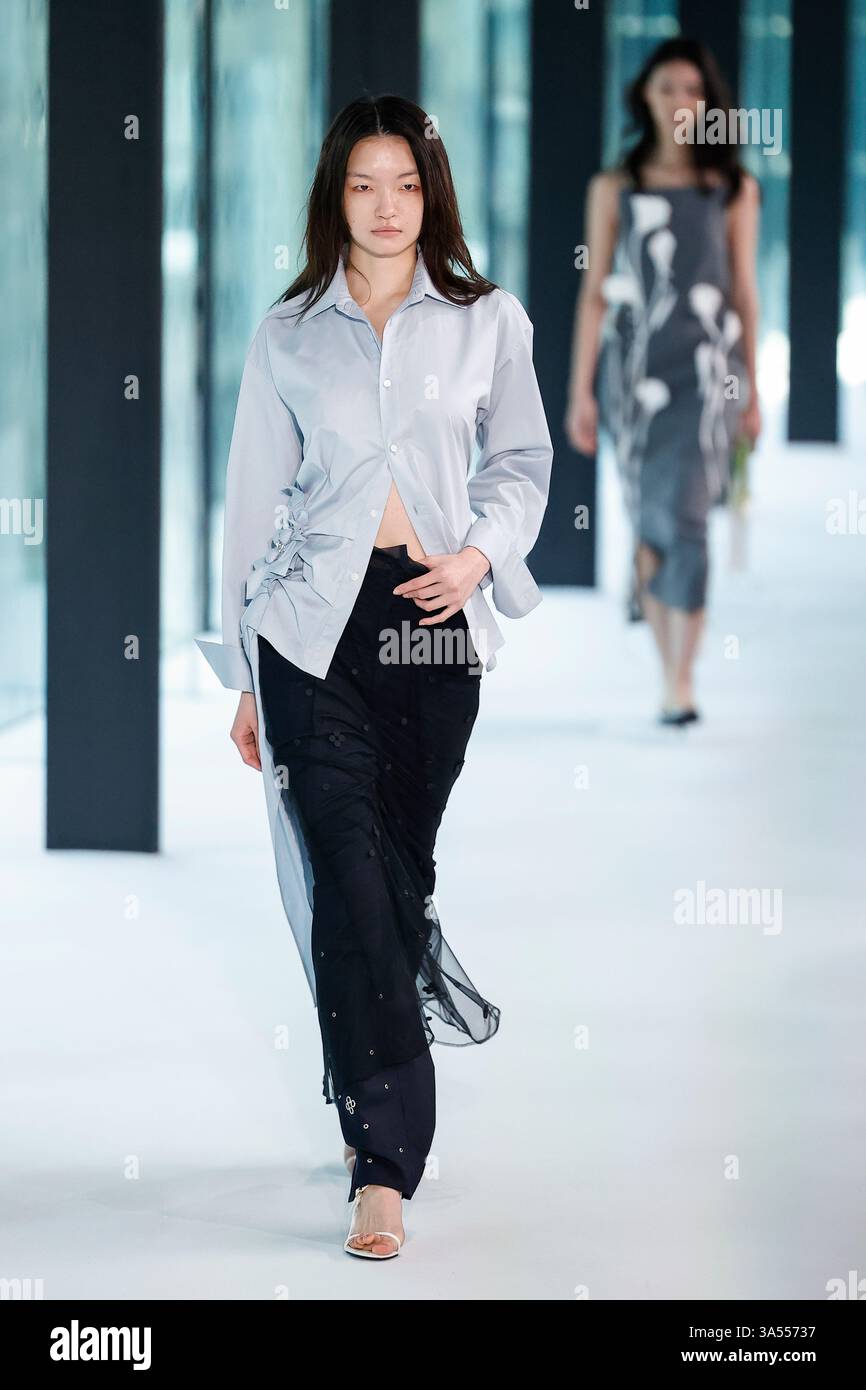 Tokyo, Japan. 21st Mar, 2025. Models wearing fashion brand RIV NOBUHIKO ...