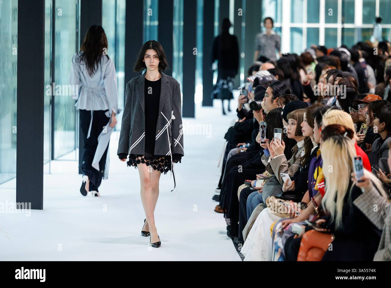 Tokyo, Japan. 21st Mar, 2025. Models wearing fashion brand RIV NOBUHIKO ...