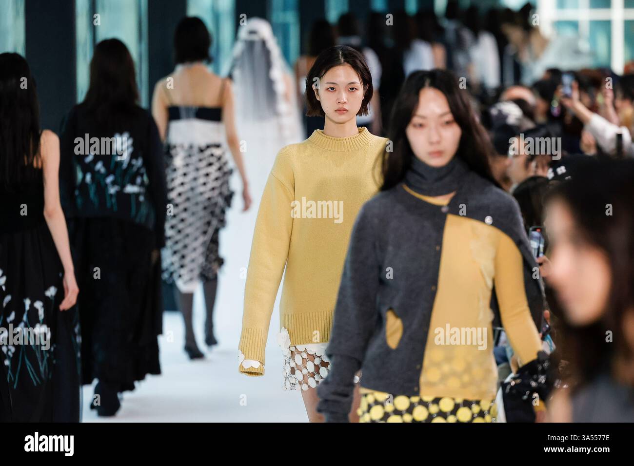 Tokyo, Japan. 21st Mar, 2025. Models wearing fashion brand RIV NOBUHIKO ...