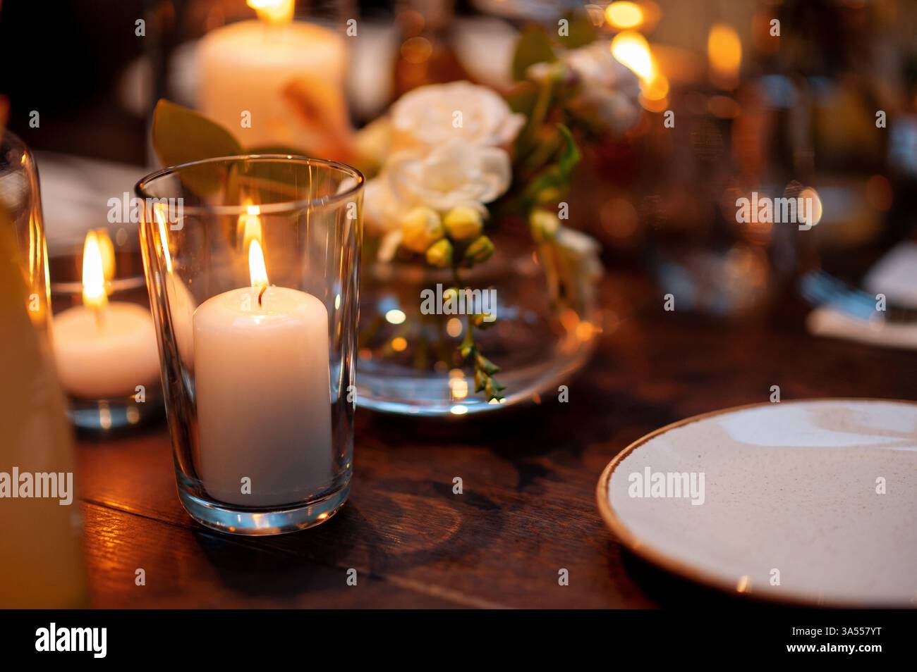 Cozy Candlelit Dining Table Setting Stock Photo - Alamy