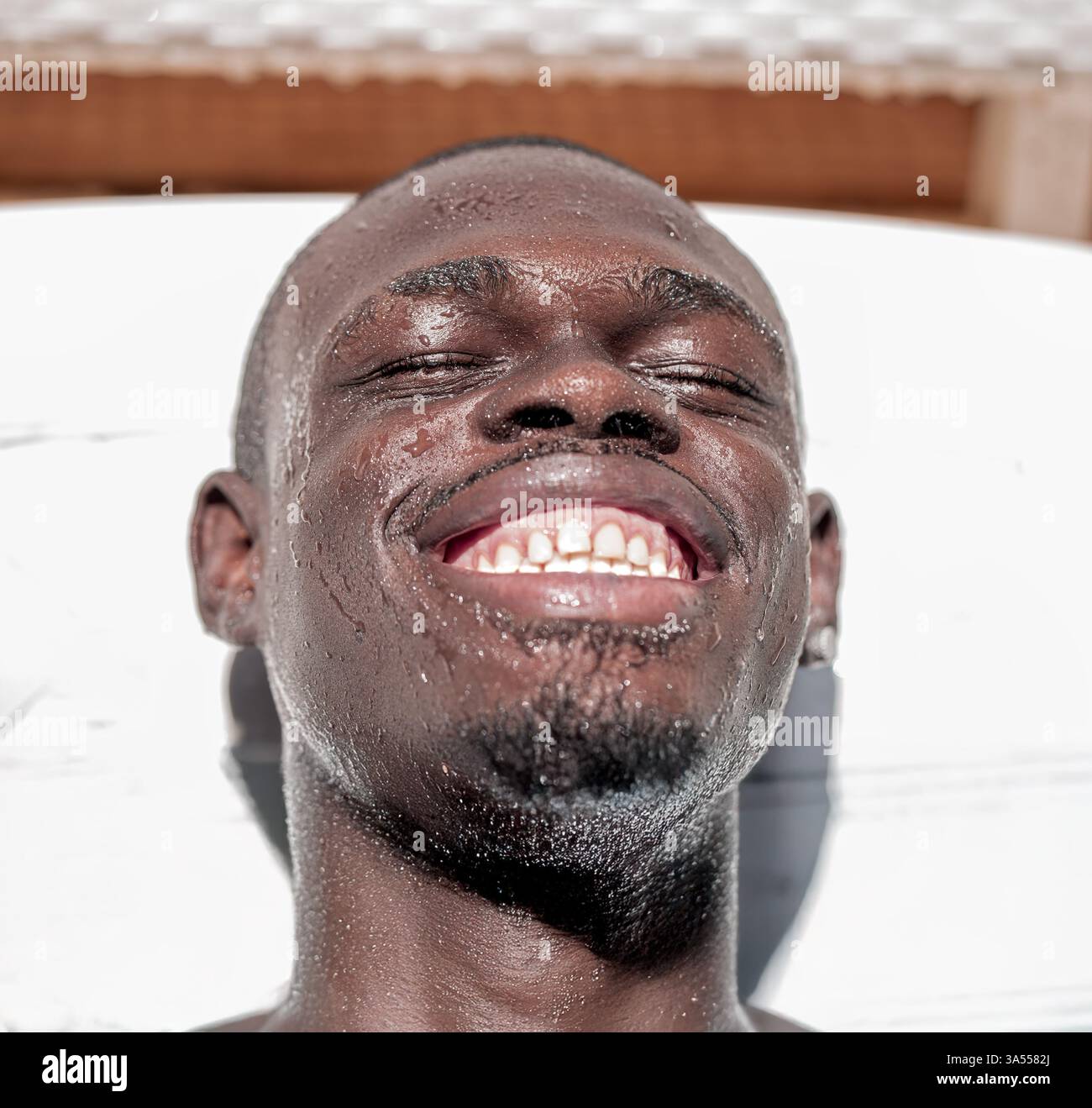 African Descent Man Smiling with Eyes Closed Stock Photo - Alamy